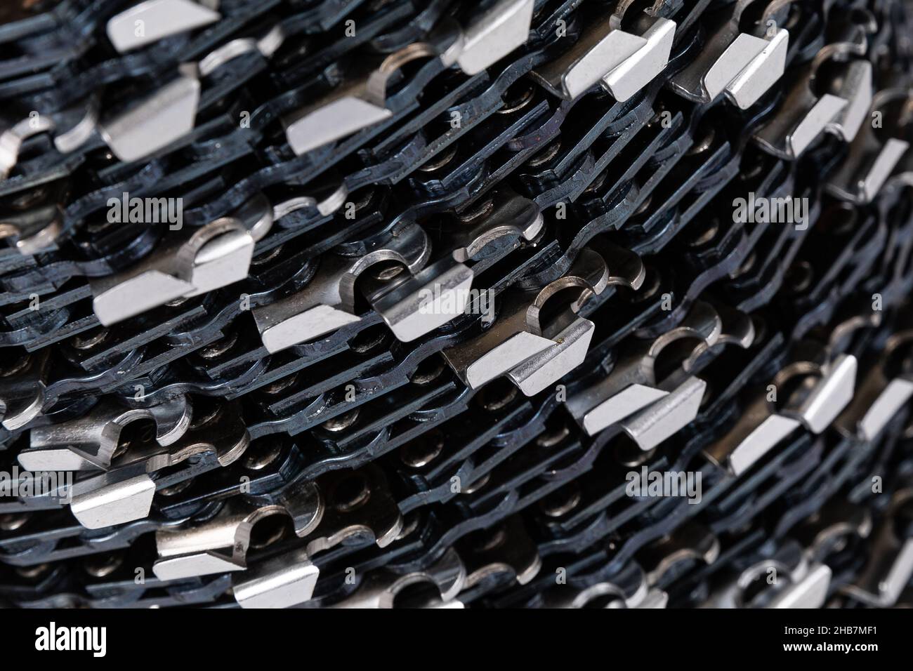 Close-up photo of gray metal saw chain. Background of sawchains Stock ...