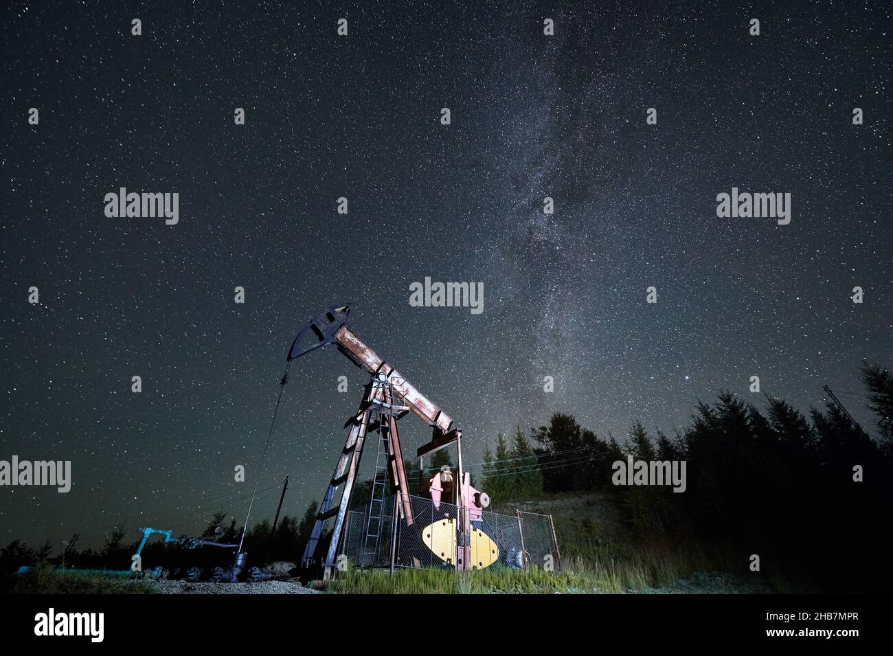 Against the background of magical starfull sky and Milky Way galaxy ...