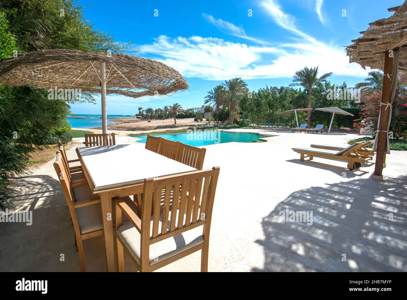 Luxury villa show home in tropical summer holiday resort with swimming ...