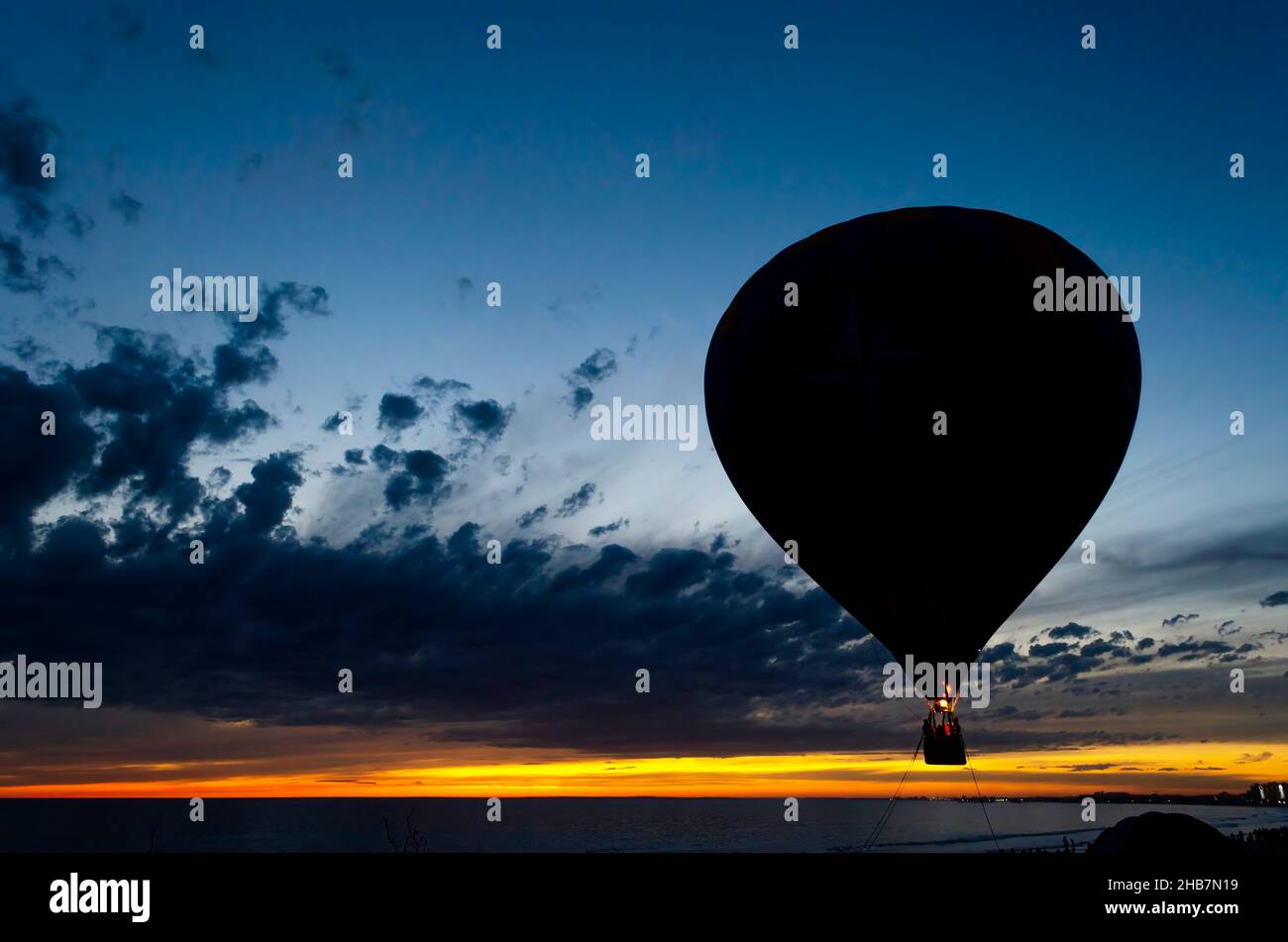 Hot air balloon over sea hi-res stock photography and images - Alamy