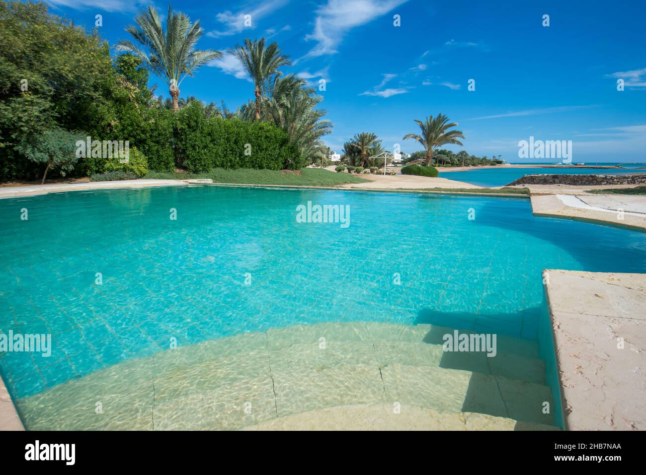 Luxury villa show home in tropical summer holiday resort with swimming ...