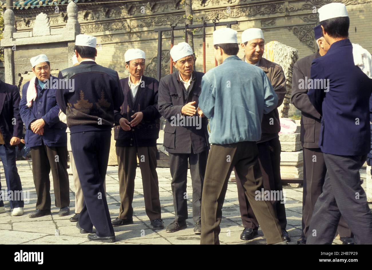 chinese Muslim people pray at the Great Mosque in the Muslim Quarter in ...