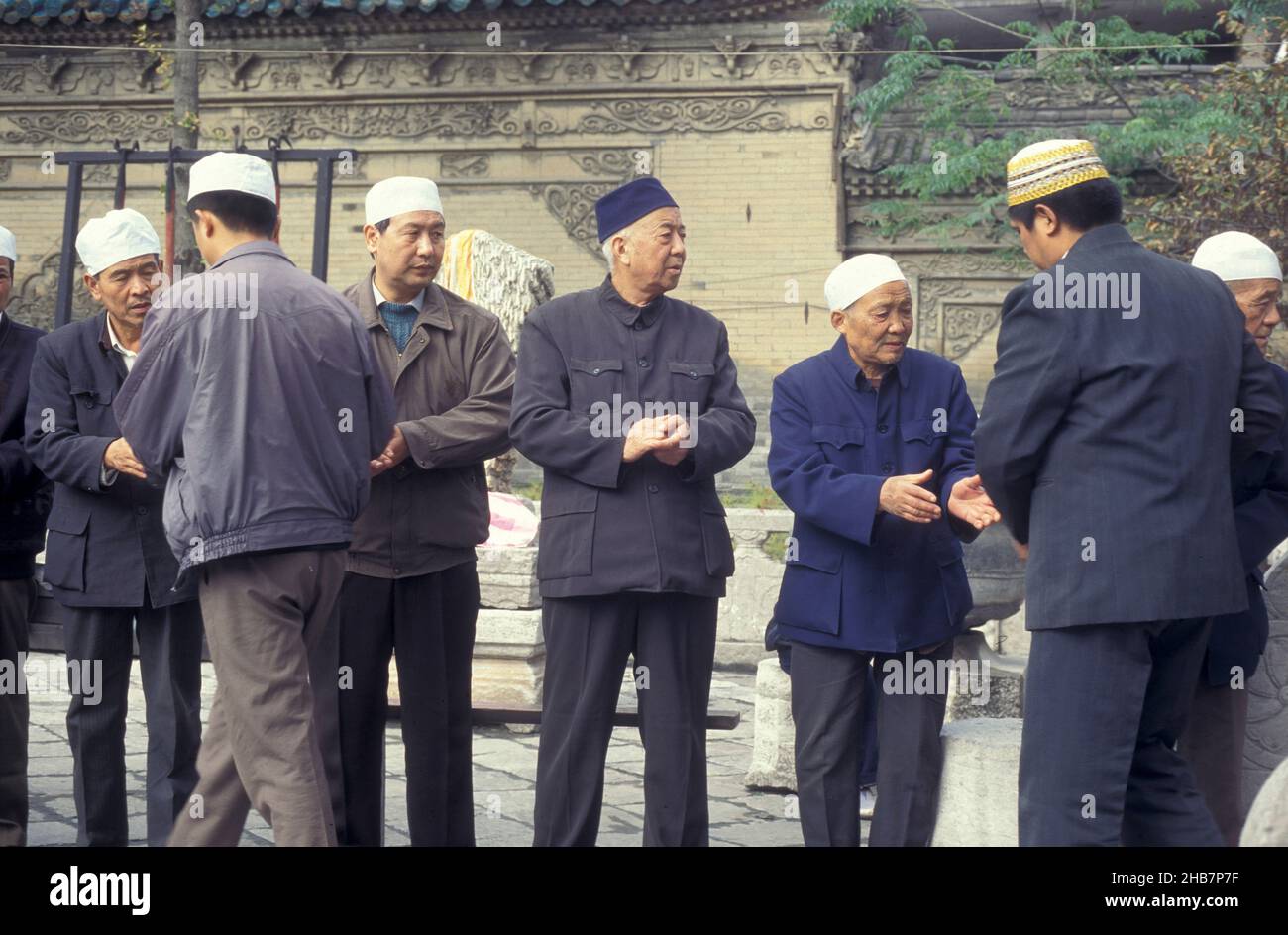 chinese Muslim people pray at the Great Mosque in the Muslim Quarter in ...