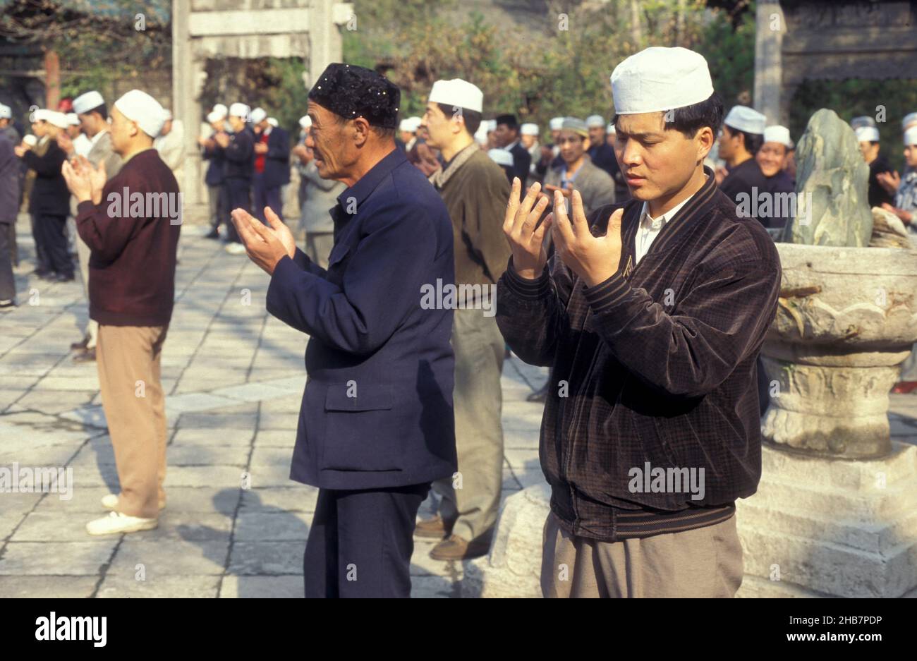 chinese Muslim people pray at the Great Mosque in the Muslim Quarter in ...