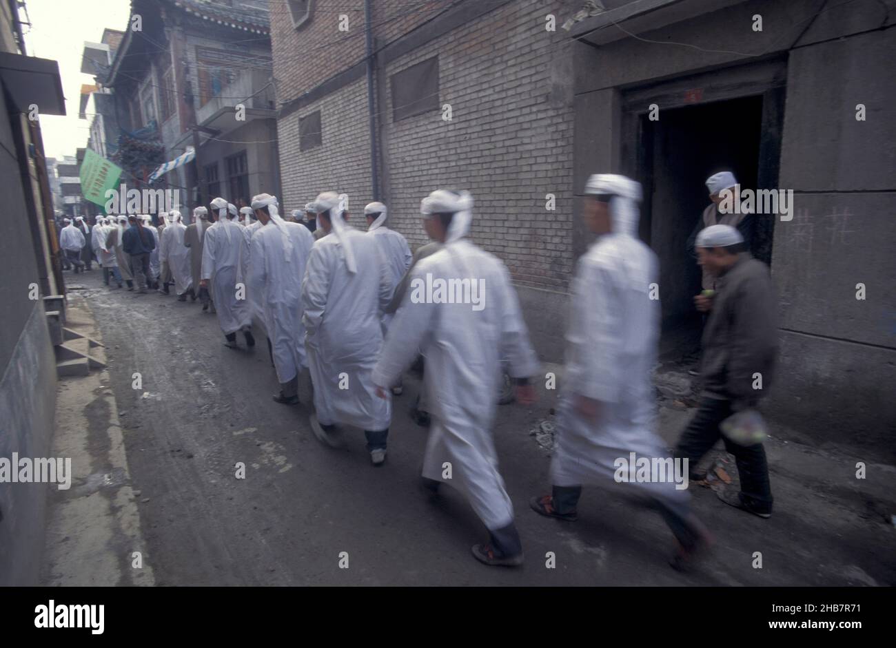 chinese Muslim people pray at the Great Mosque in the Muslim Quarter in ...