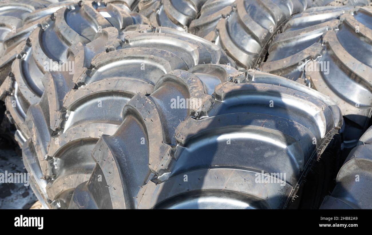 Close-up photo of black big tires on wheels for large cars Stock Photo ...