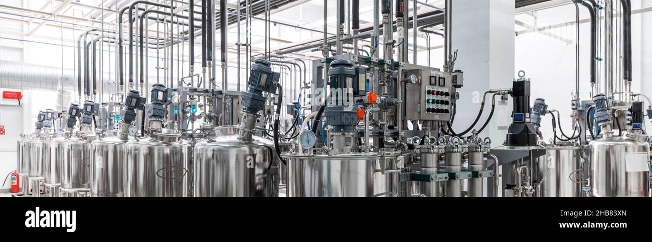 Panoramic photo of pipes and tanks. Chemistry and medicine production ...