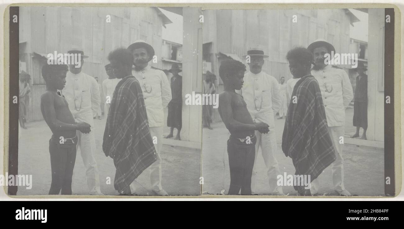 Two Europeans amidst some Moluccan inhabitants of Dobo, Aru Islands ...