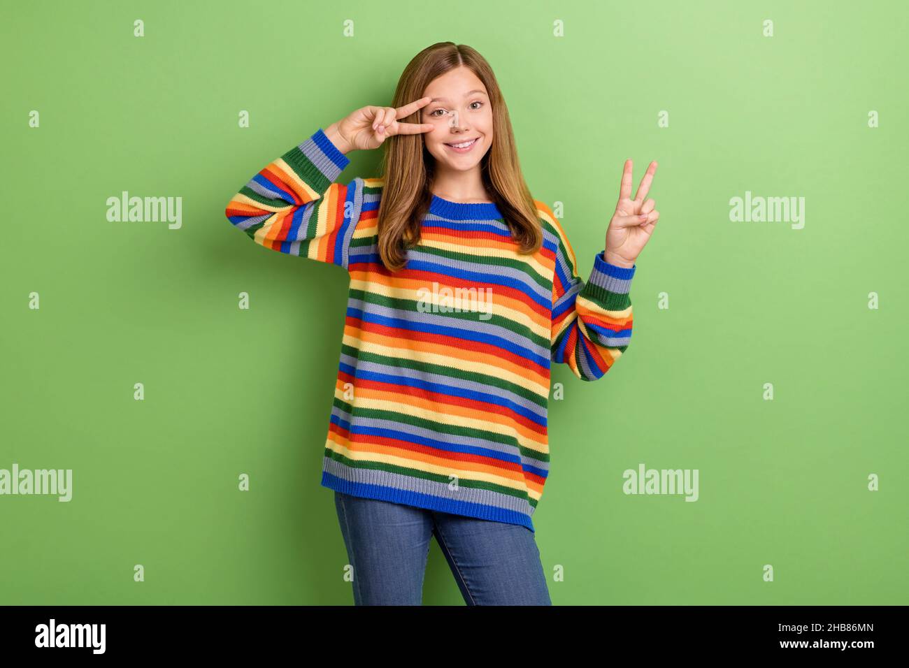 Portrait of attractive girly cheerful funky funny girl showing v-sign ...