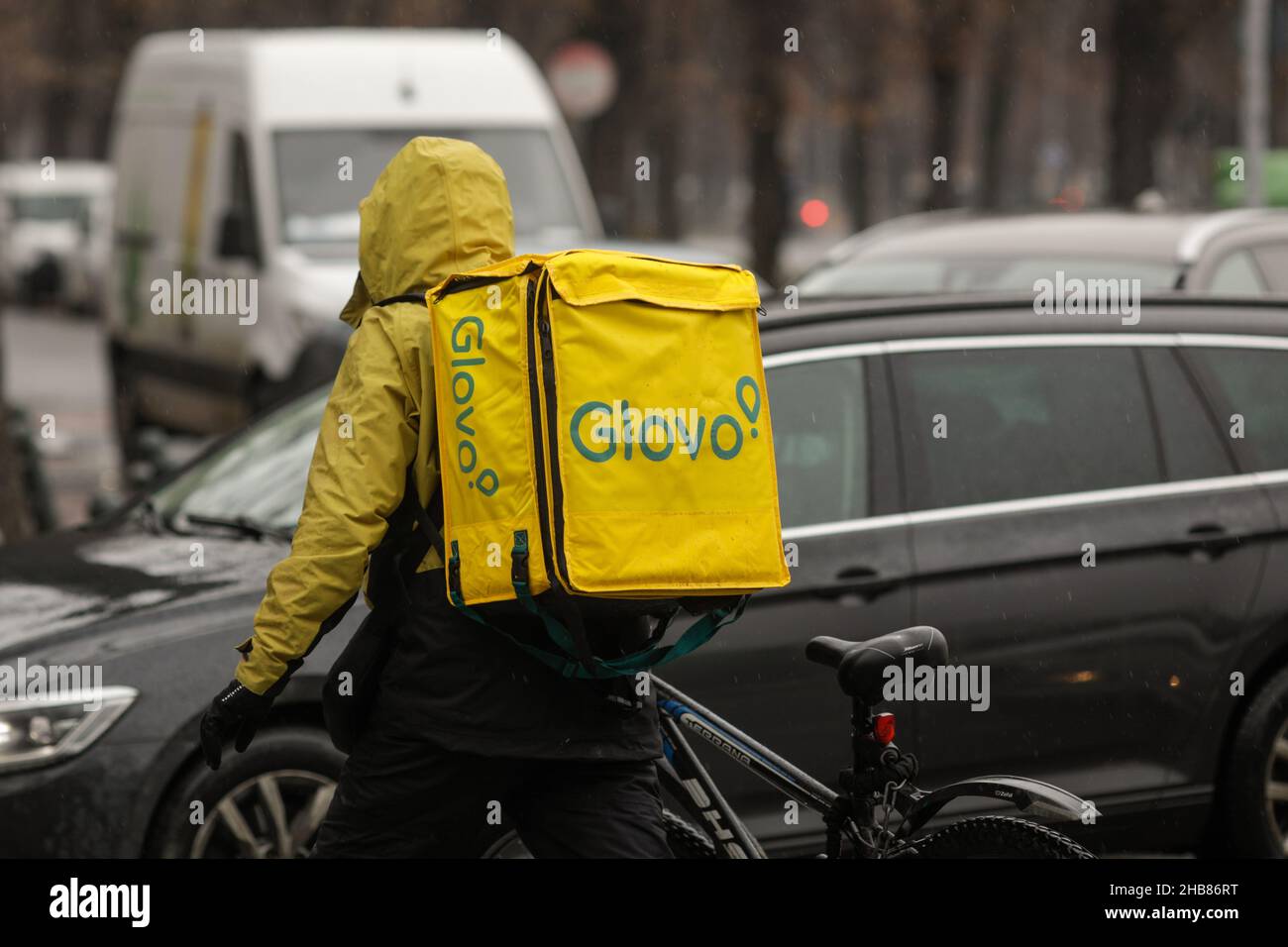 Bucharest, Romania - December 17, 2021: Man carrying a Glovo delivery ...