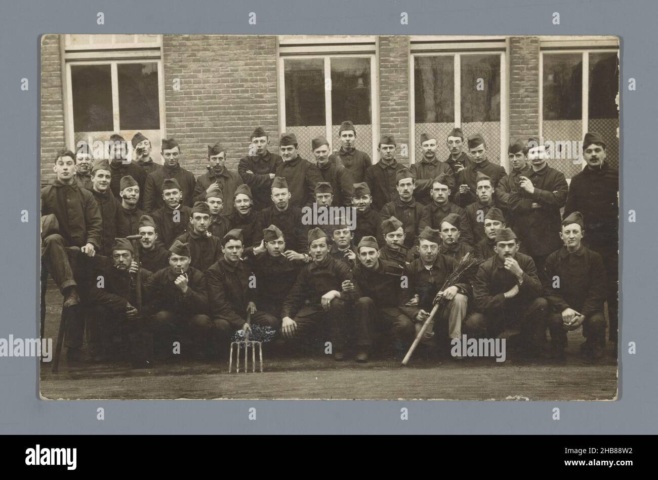 Group portrait of soldiers in uniform in front of a building, anonymous ...