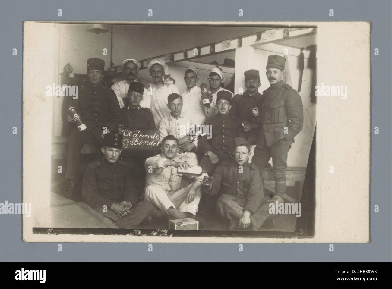 Group portrait of soldiers around a sign reading The Black Gang ...