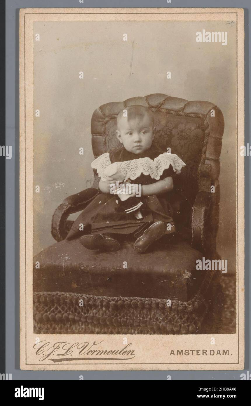 Child seated in an armchair hi-res stock photography and images - Alamy