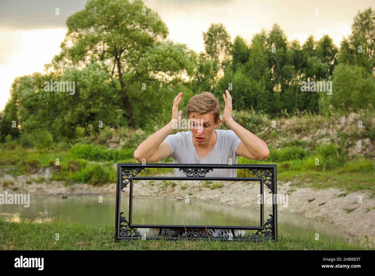 A guy with a picture on the nature Stock Photo - Alamy