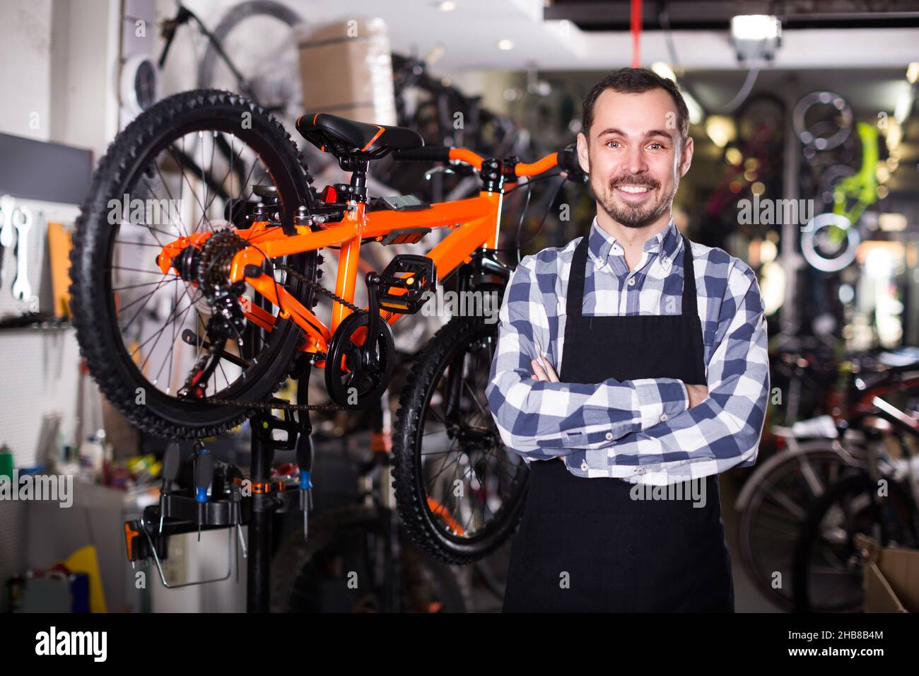 Mechanic is working on master bicycle assembly Stock Photo - Alamy