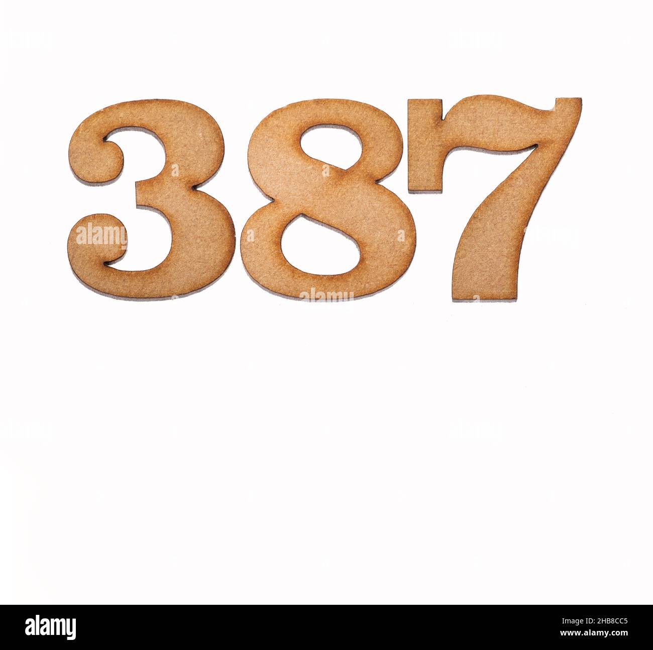 Number 387 - Piece of wood isolated on white background Stock Photo - Alamy