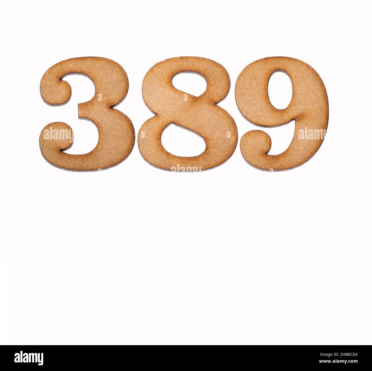 Number 389 - Piece of wood isolated on white background Stock Photo - Alamy