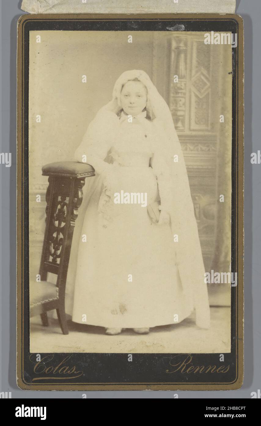 Portrait of an unknown girl in white dress before her first communion ...