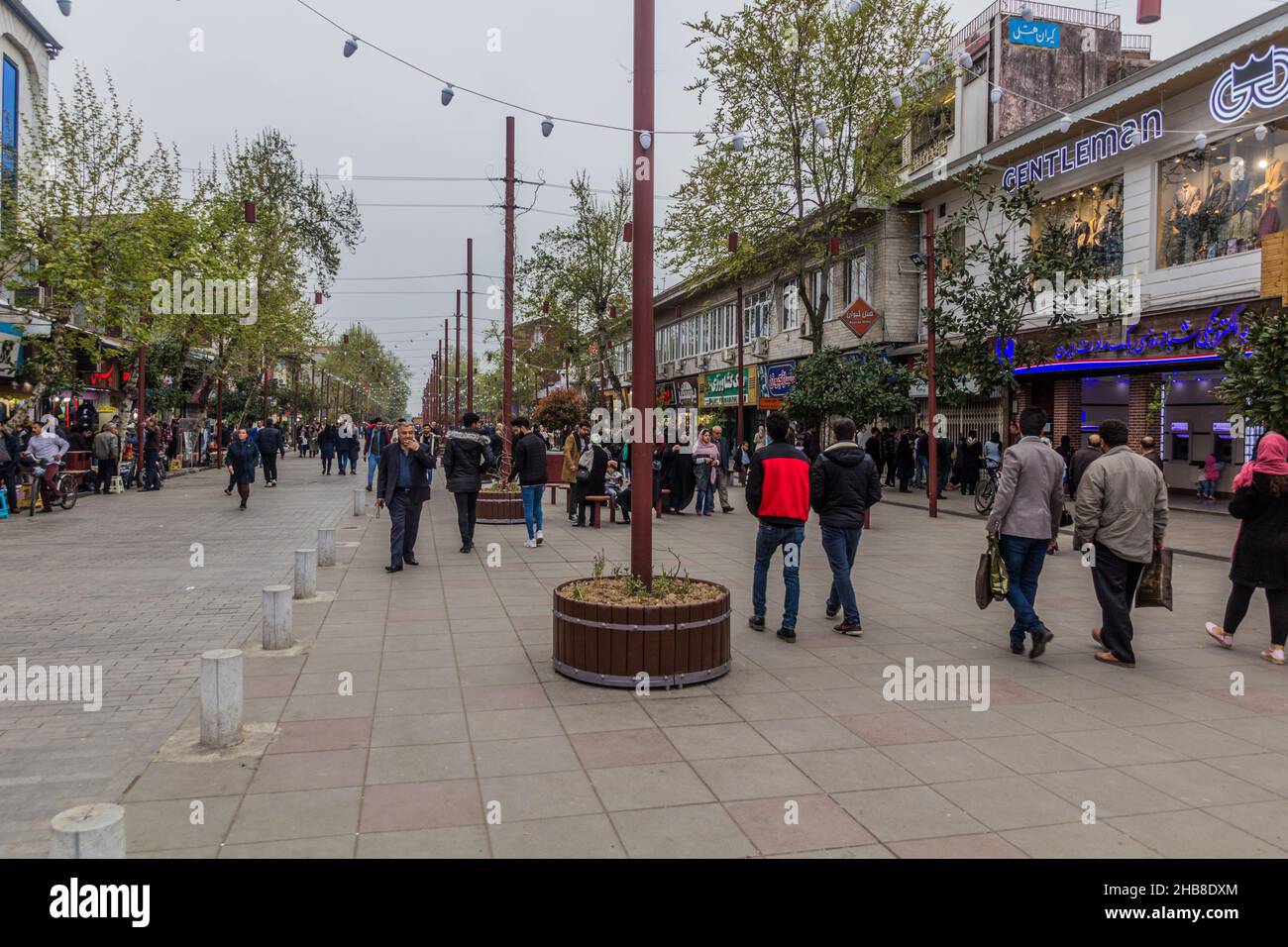 RASHT, IRAN - APRIL 6, 2018: People walking on a pedestrian street in ...