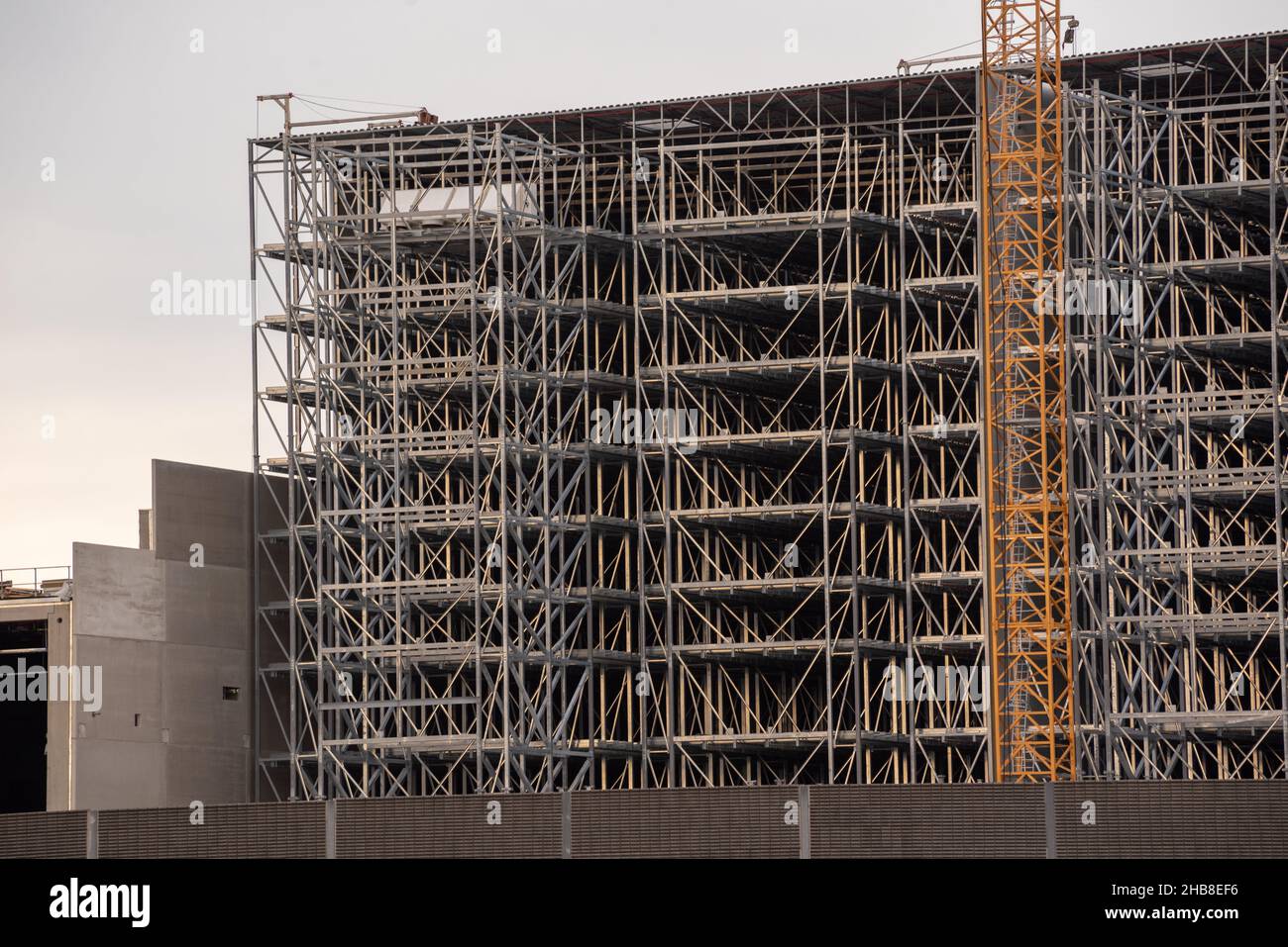 Warehouse under construction without external wall. Metal shelves of a ...