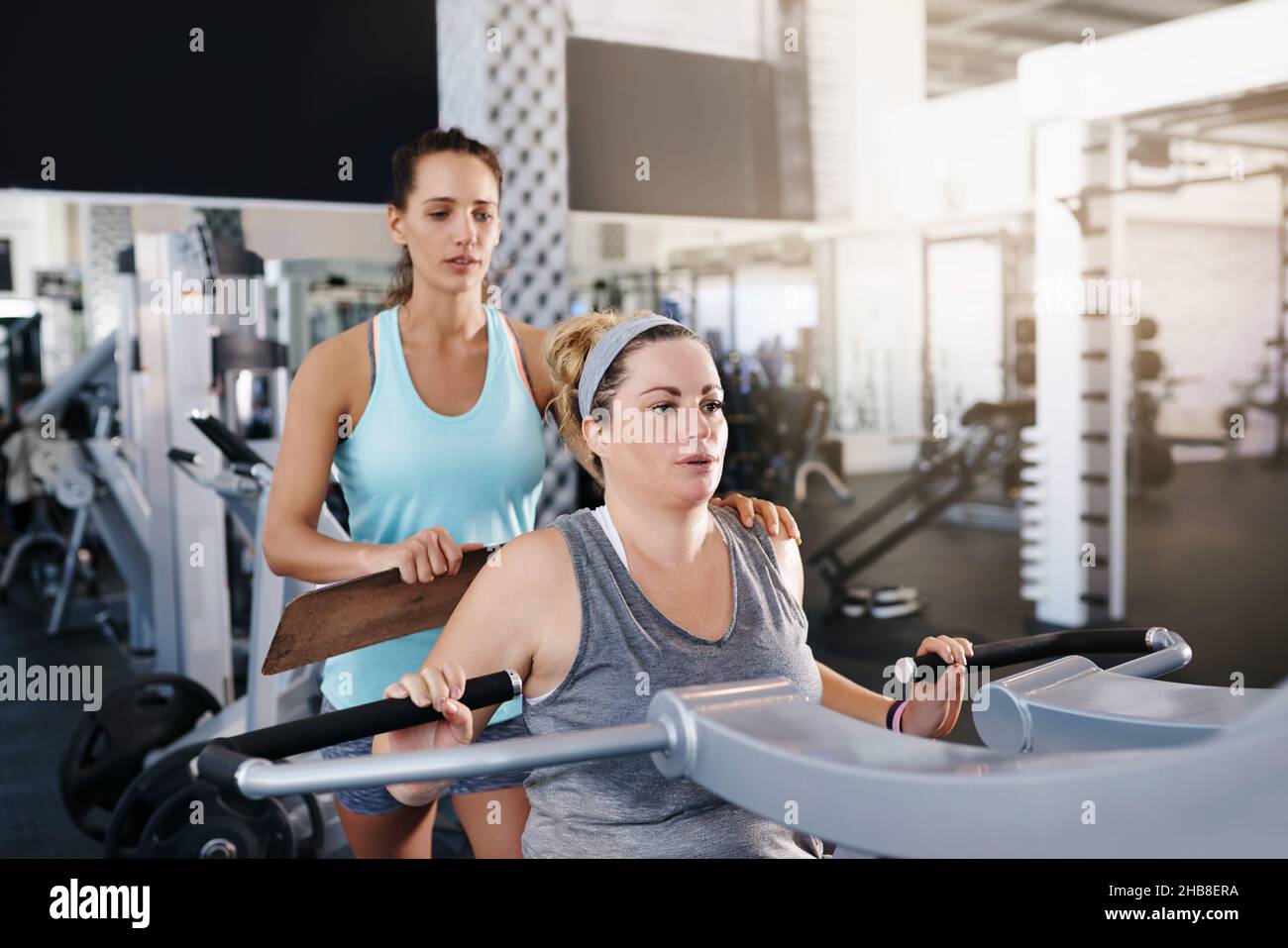 Giving her the push she needs Stock Photo - Alamy