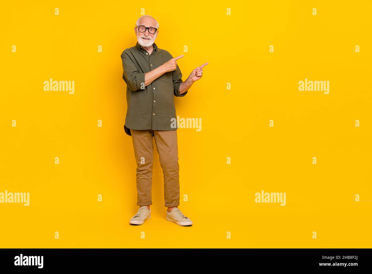 Full length portrait of cheerful positive person indicate fingers empty ...