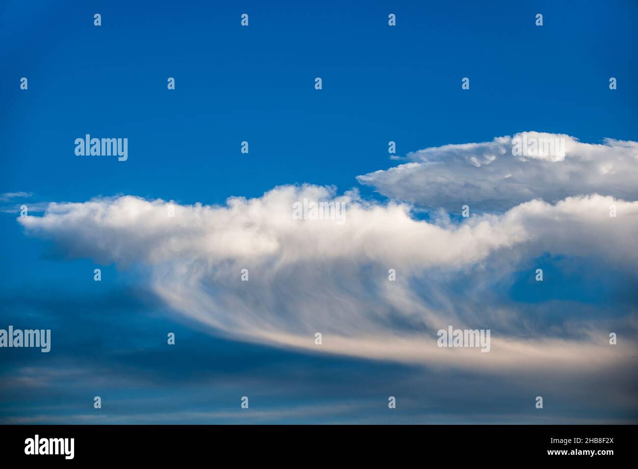 Cirrus floccus cloud formation against blue sky Stock Photo - Alamy