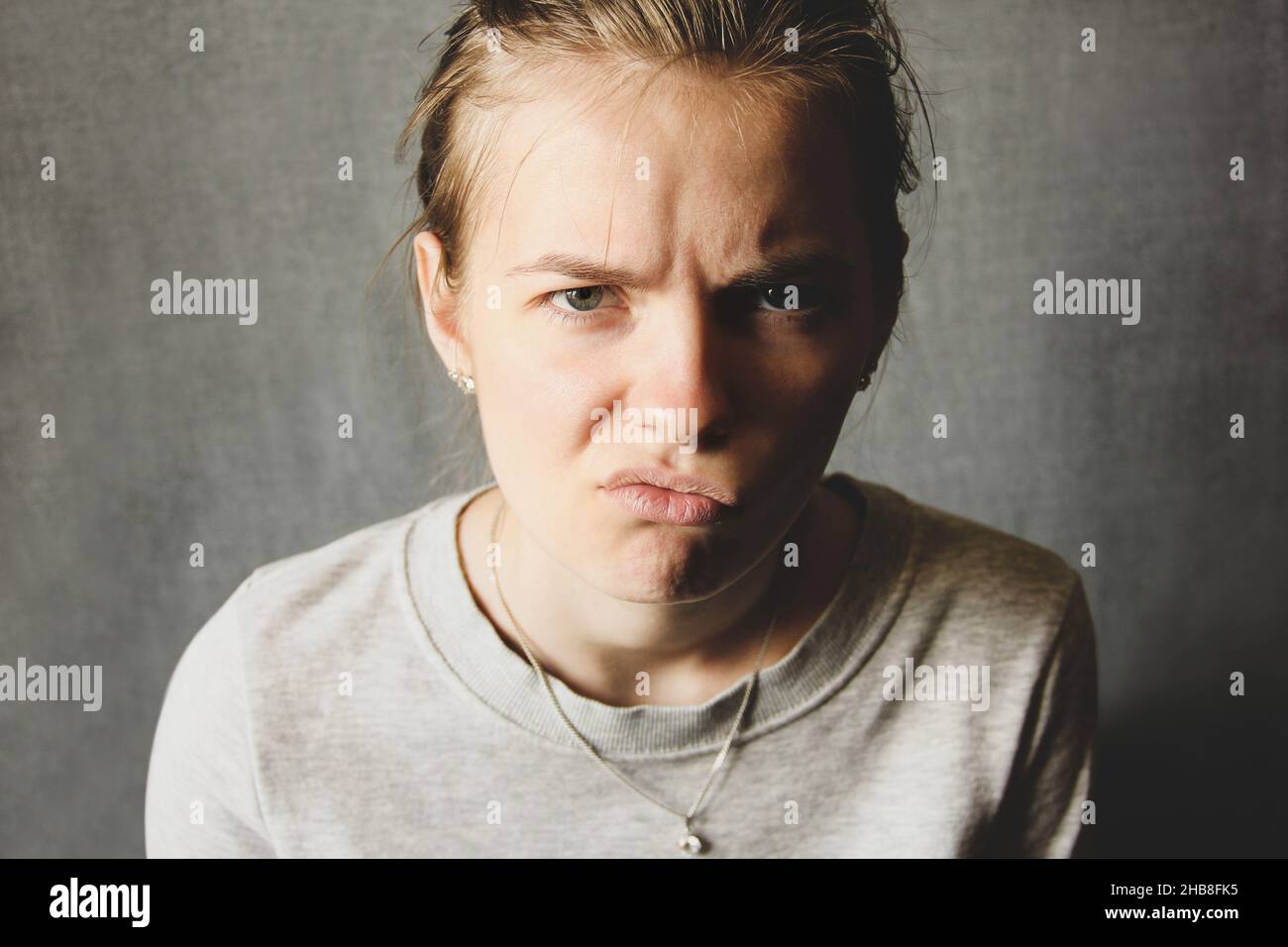 The girl is angry. Emotional girl. Facial emotions Stock Photo - Alamy