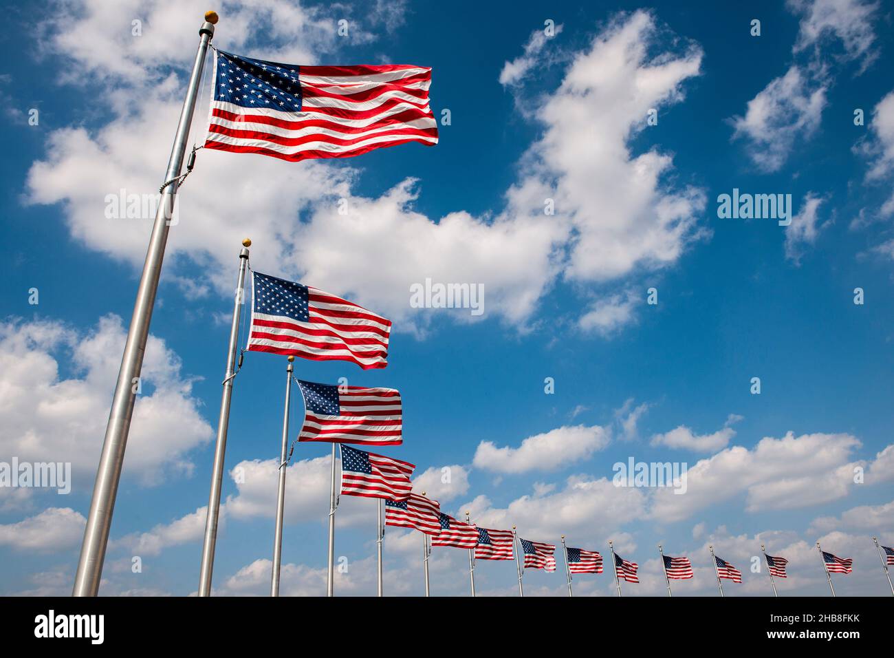 USA, Washington D.C., Row of American flags around Washington Monument ...