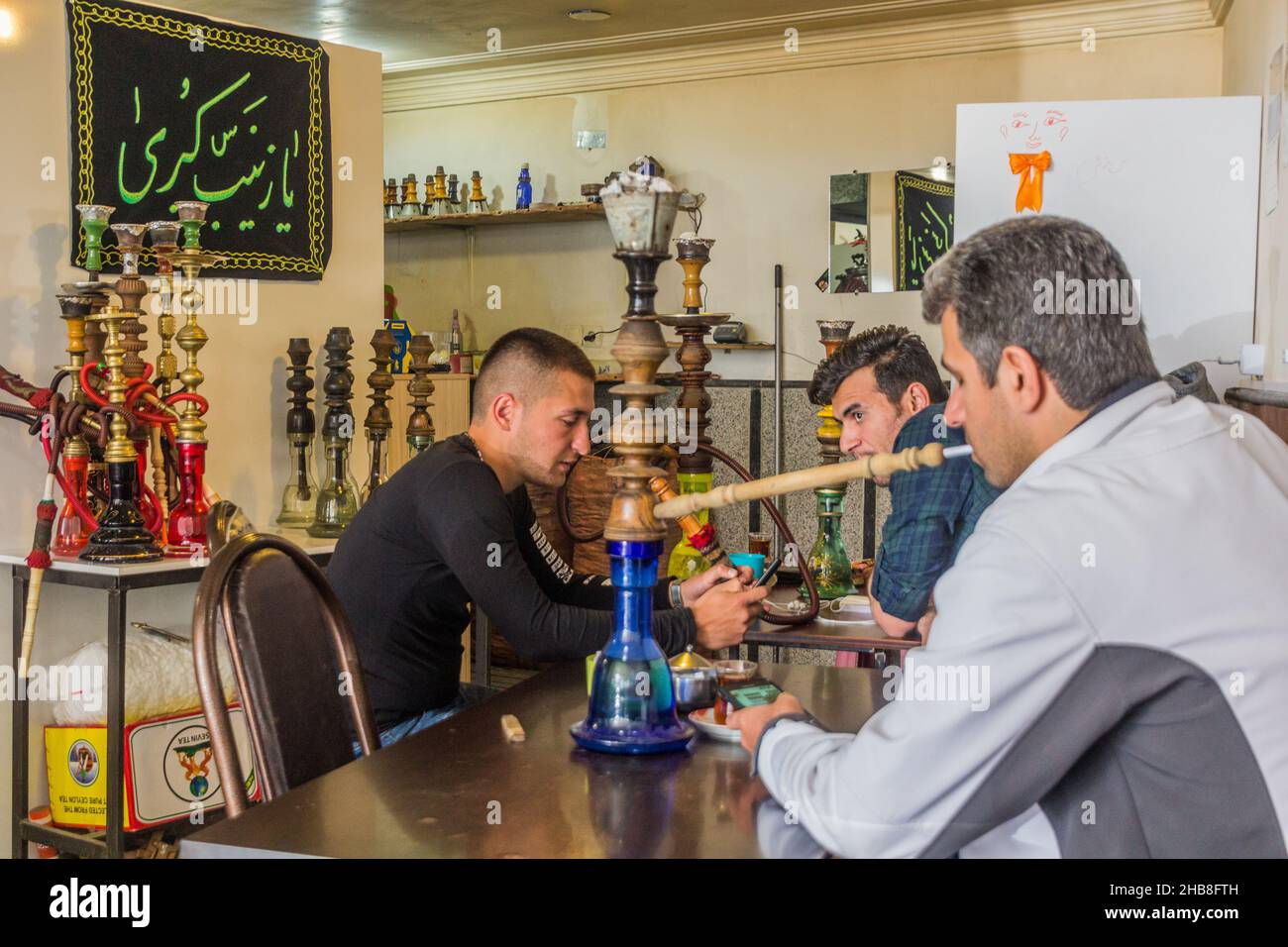 ARDABIL, IRAN - APRIL 11, 2018: Local people with waterpipes in a tea ...