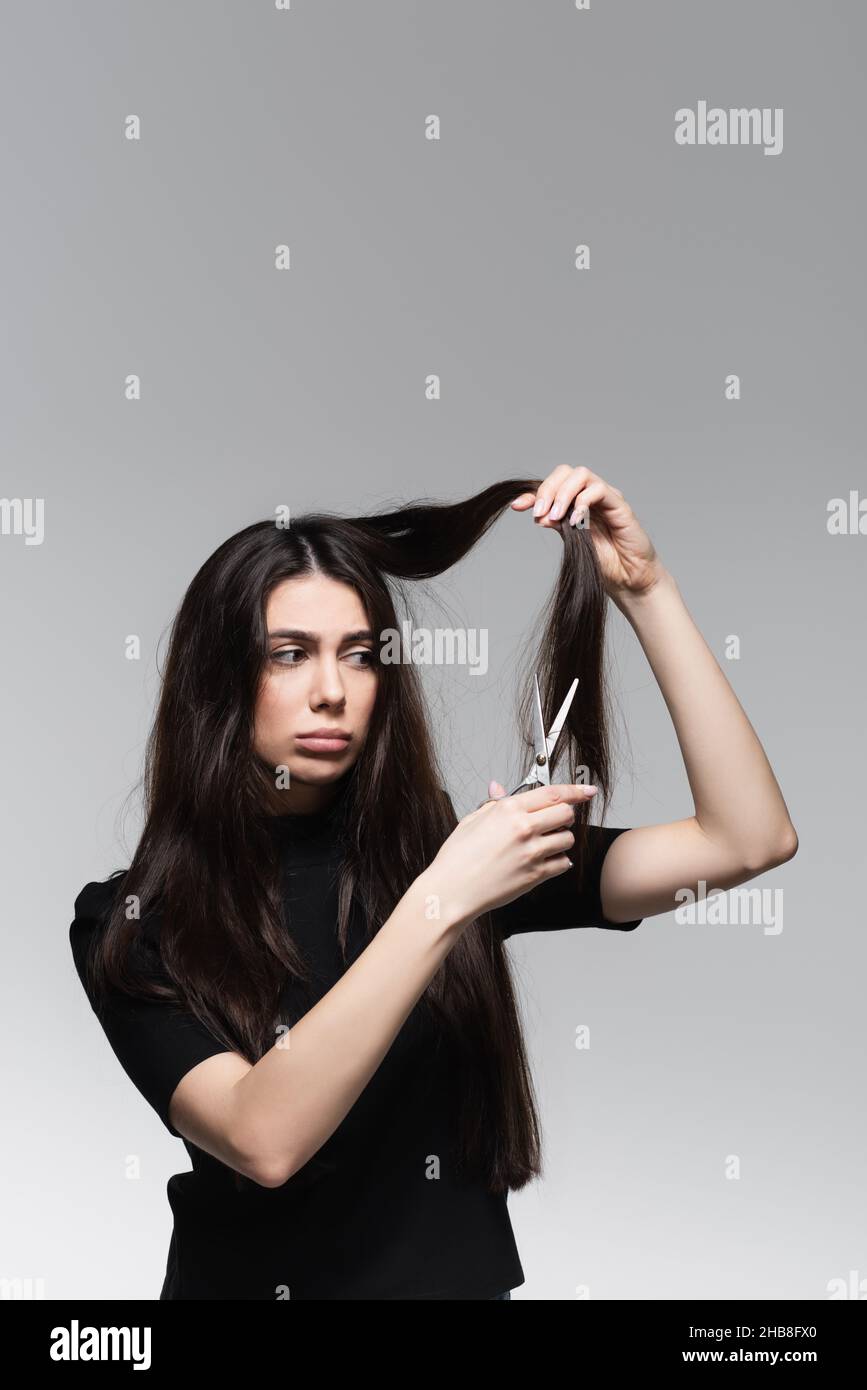 Cutting hair scissors unhappy hi-res stock photography and images - Alamy