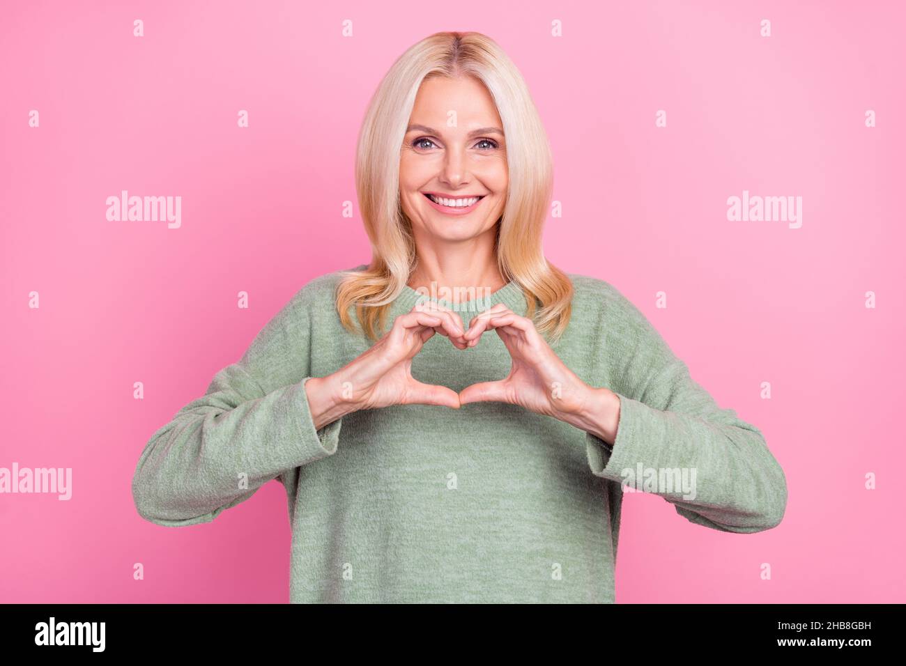 Photo of pretty charming lady pensioner dressed green pullover showing ...