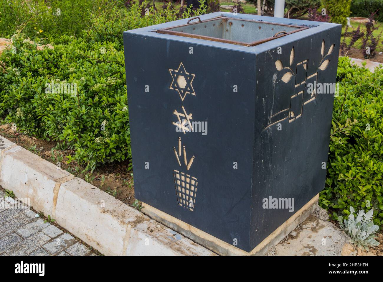 TEHRAN, IRAN - APRIL 14, 2018: Bombs falling into a garbage bin symbol ...