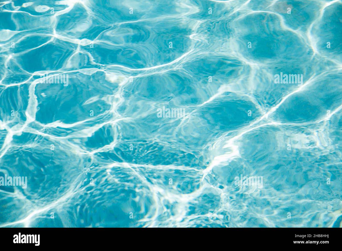 Surface of blue rippled water reflecting sunlight Stock Photo - Alamy