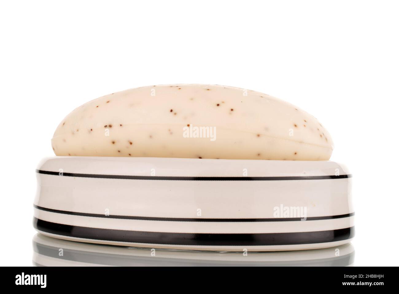 One fragrant bar of soap on a ceramic soap dish, close-up, isolated on ...