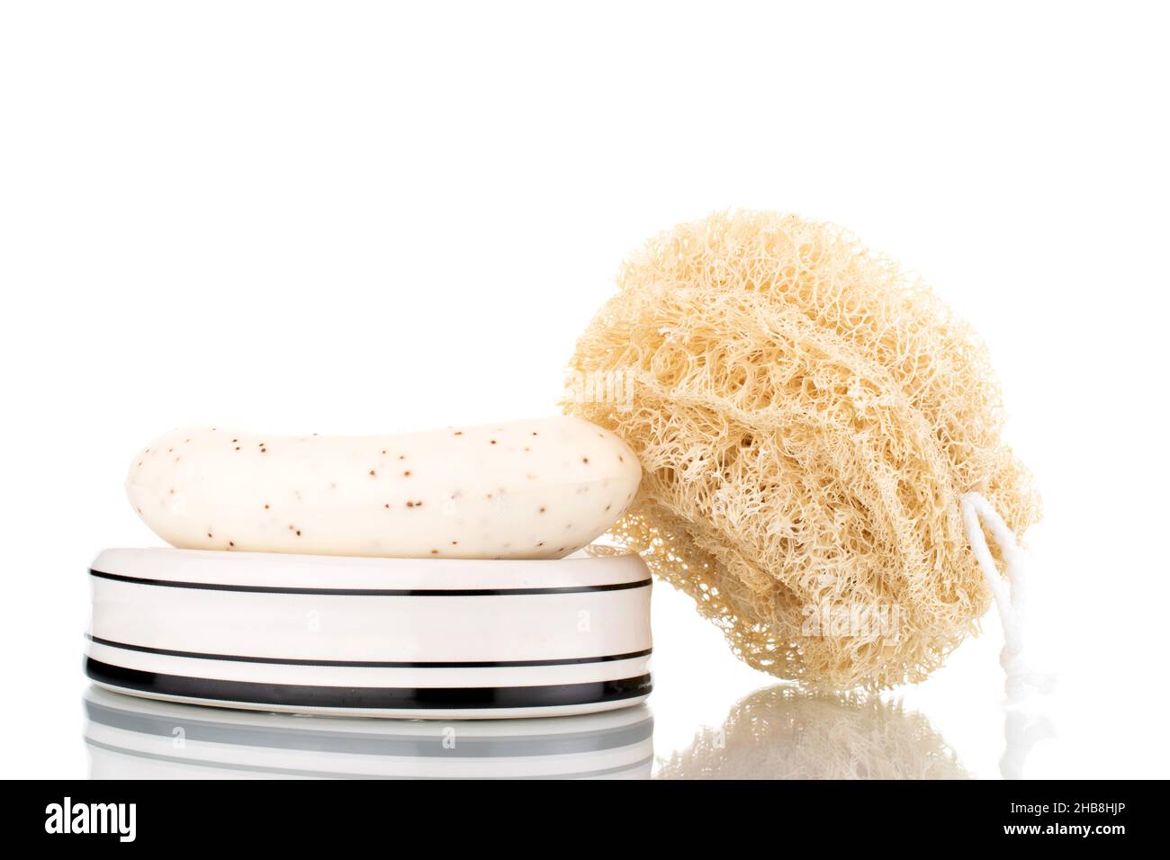 One loofah shower sponge with one soap, close-up, isolated on white ...