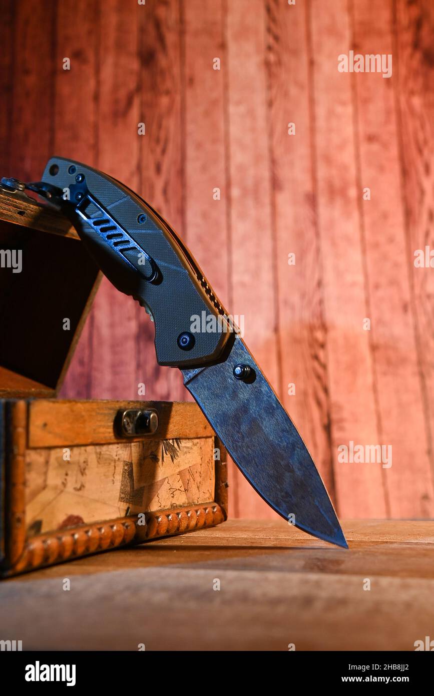 sharp knife on wooden background with vintage jewelry box Stock Photo ...