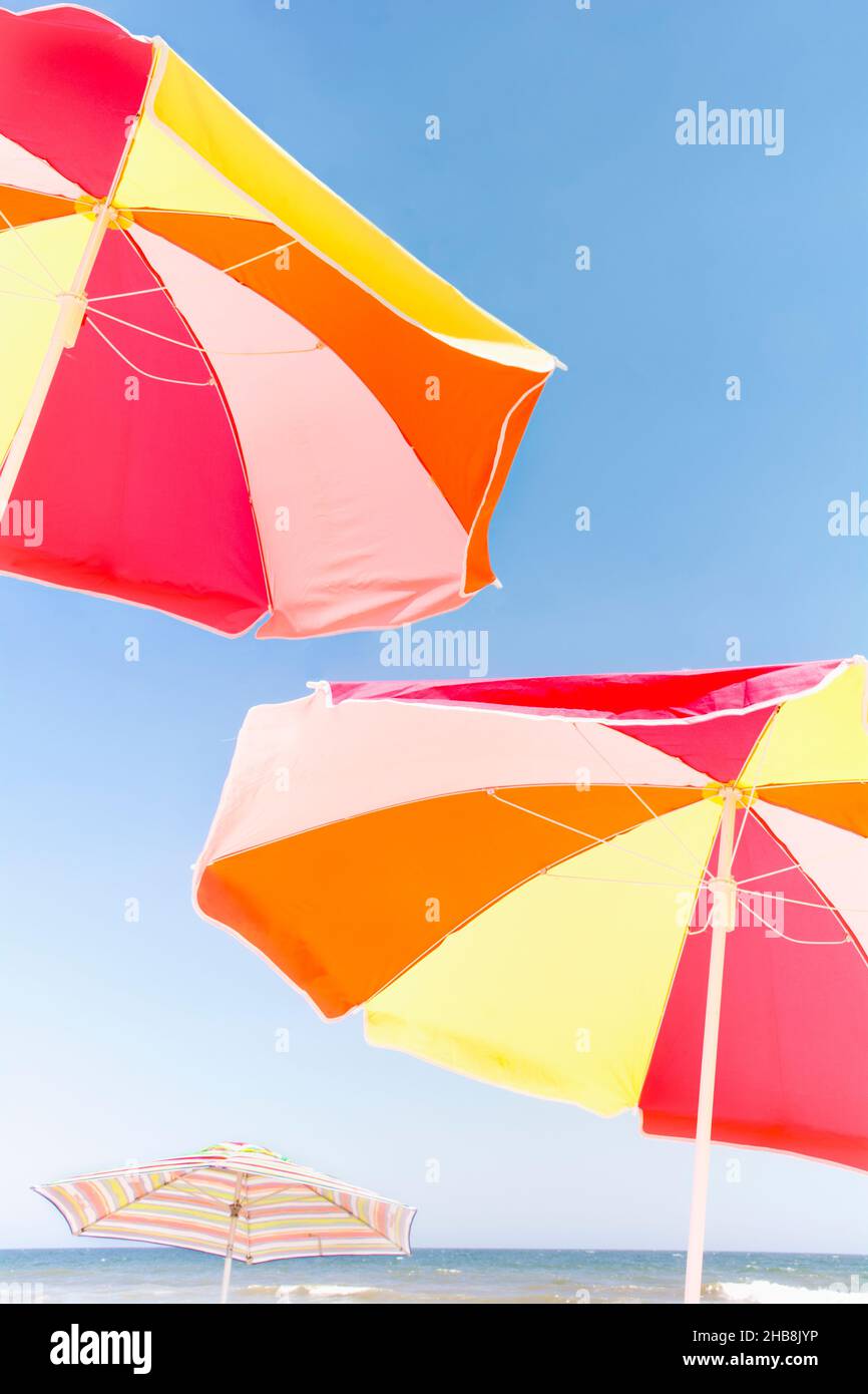 Beach umbrellas against blue hi-res stock photography and images - Alamy