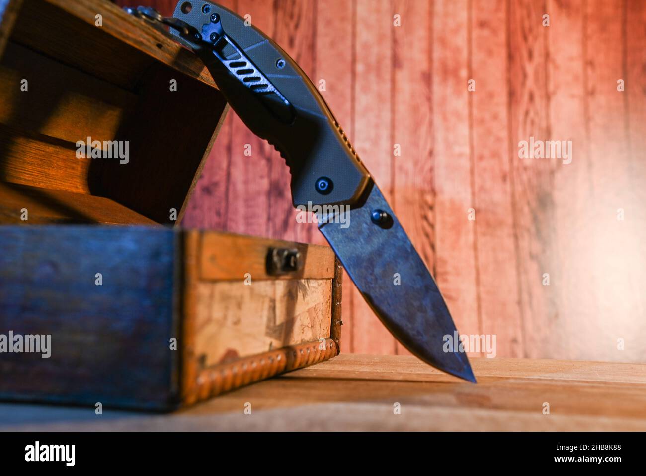 sharp knife on wooden background with vintage jewelry box Stock Photo ...