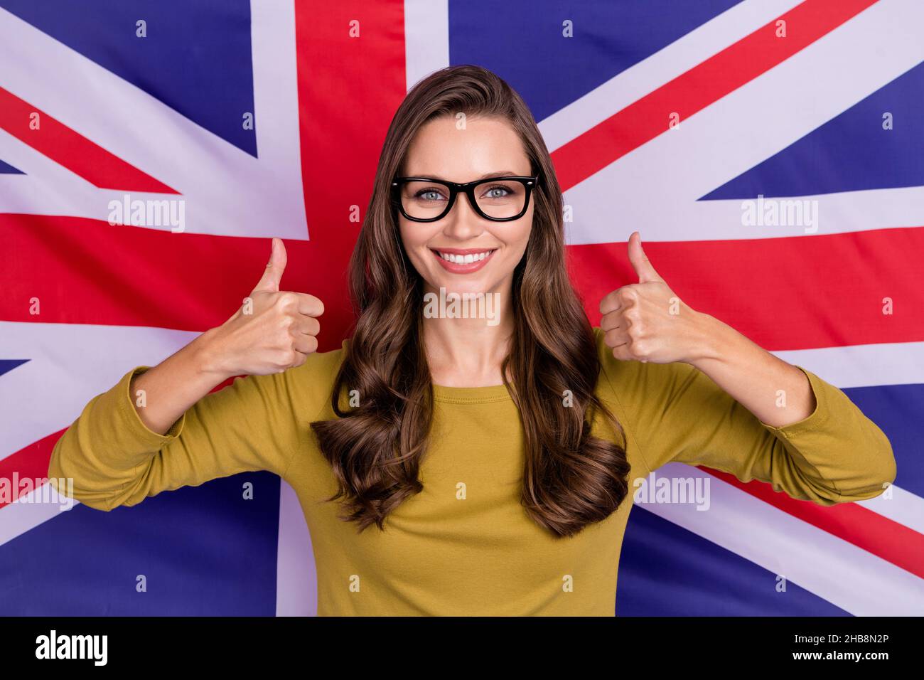 Portrait of cheerful attractive person two hands show thumbs up ...