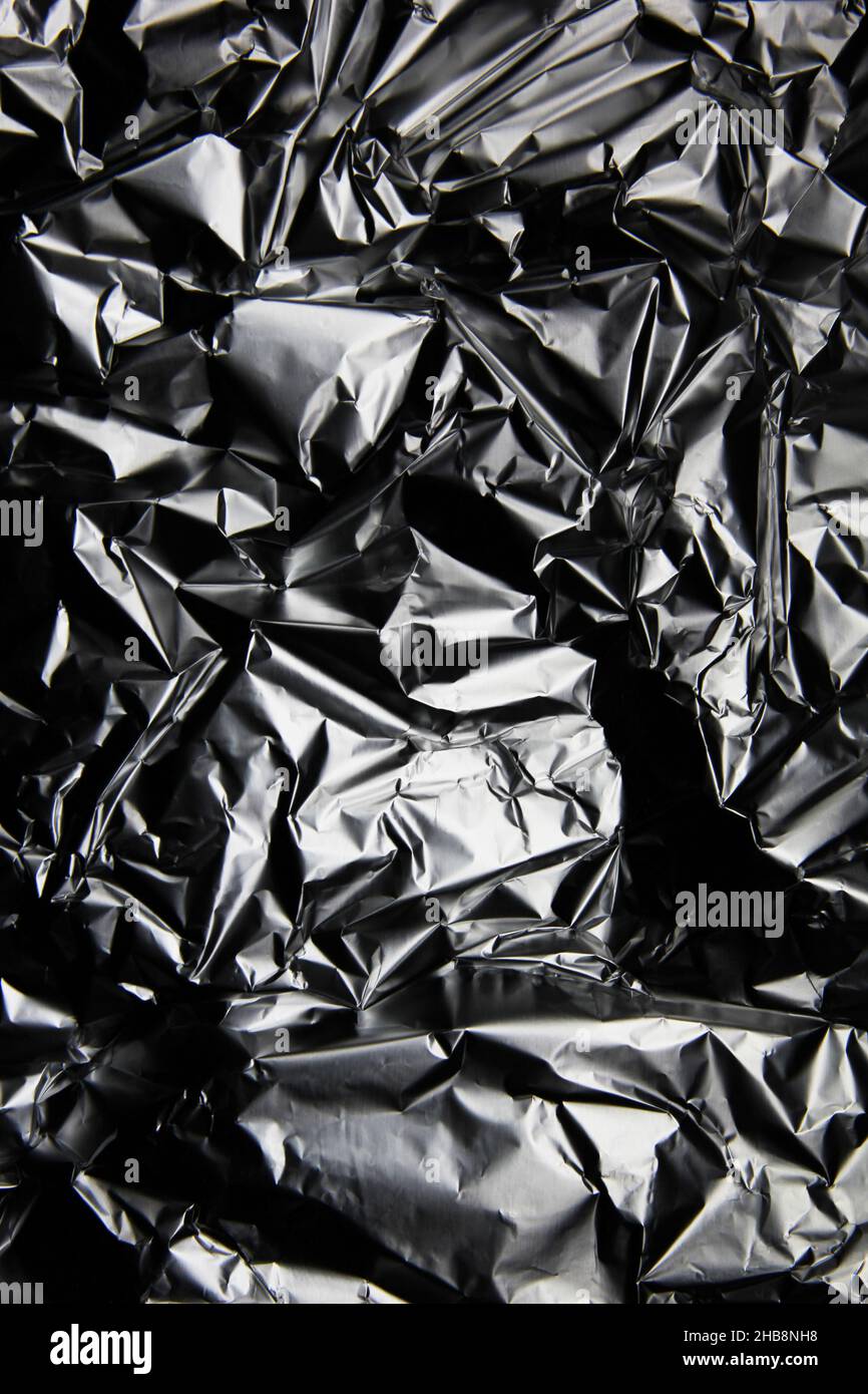 Foil background. Crumpled foil. Abstract background. Wallpaper. Gray ...