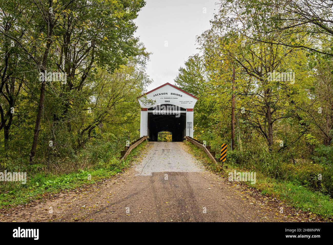 The Jackson Covered Bridge crosses Sugar Creek during Autumn leaf color ...