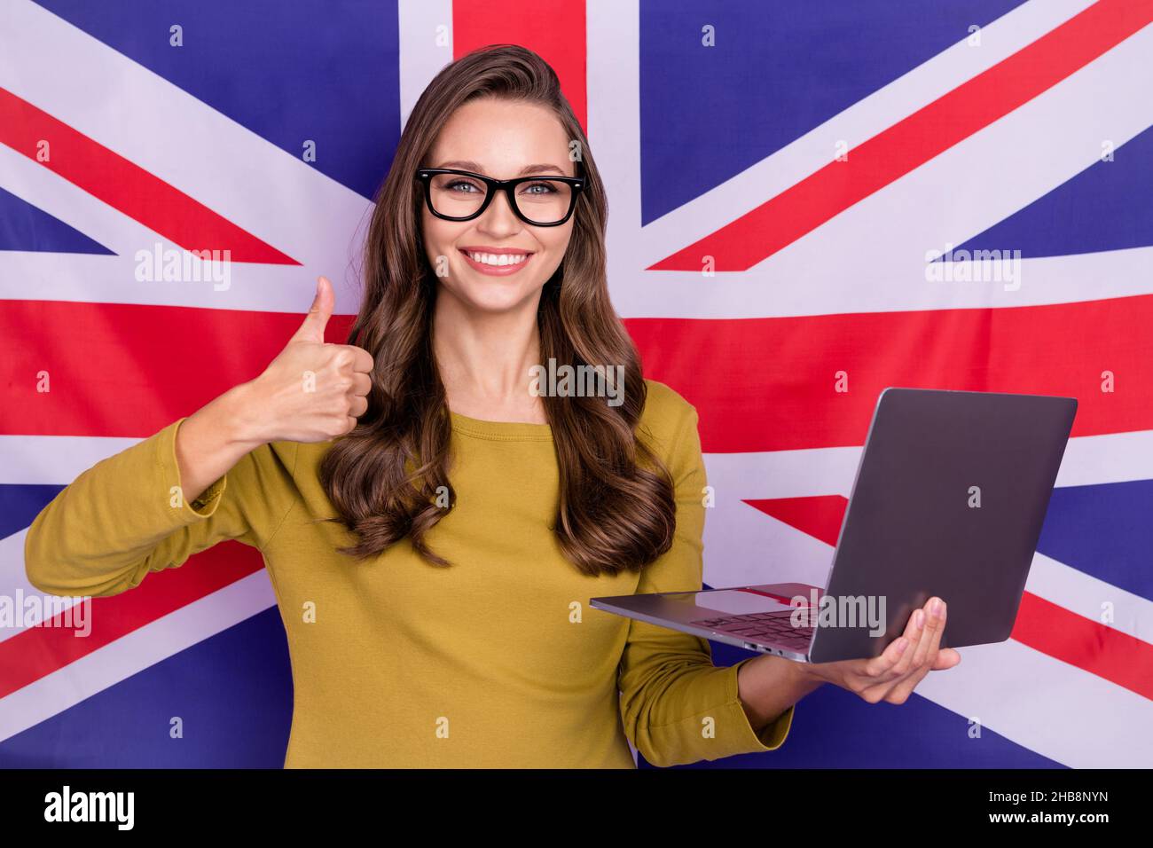 Portrait of attractive brown hair person hold netbook show thumb up ...