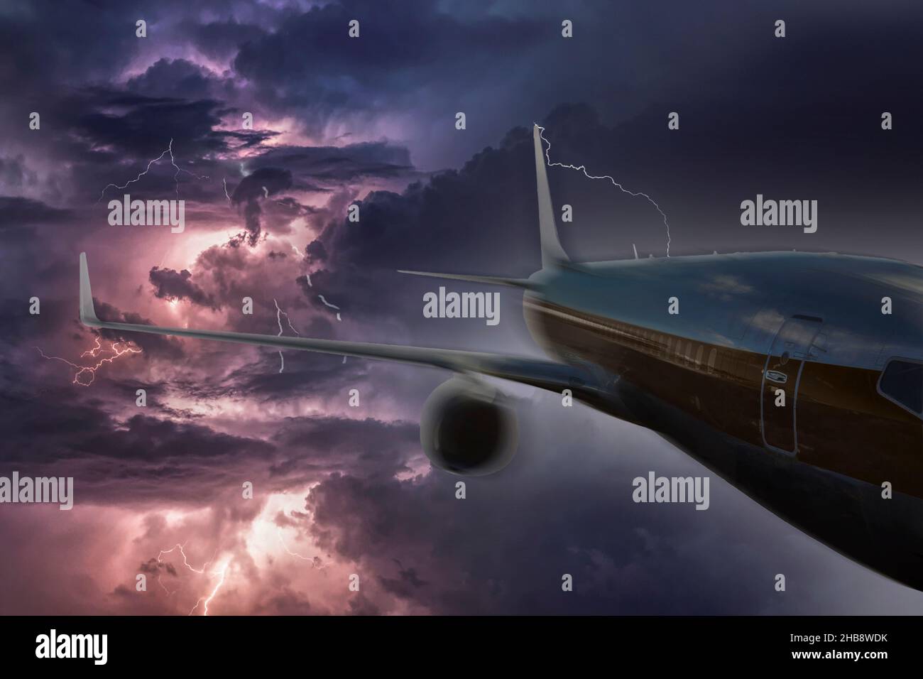 Airplane flying in thunderstorm Stock Photo - Alamy