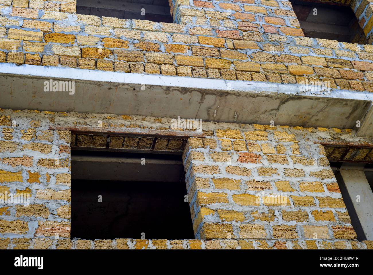 Construction. A wall of shell bricks. Window Stock Photo - Alamy