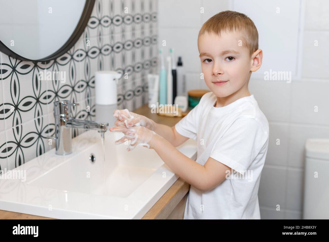Boy soap dispenser hi-res stock photography and images - Alamy