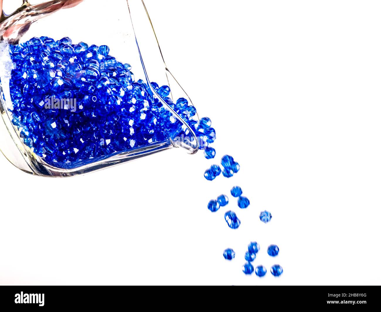 Pouring of Colorful plastic beads. Microplastics. Industrial plastic ...