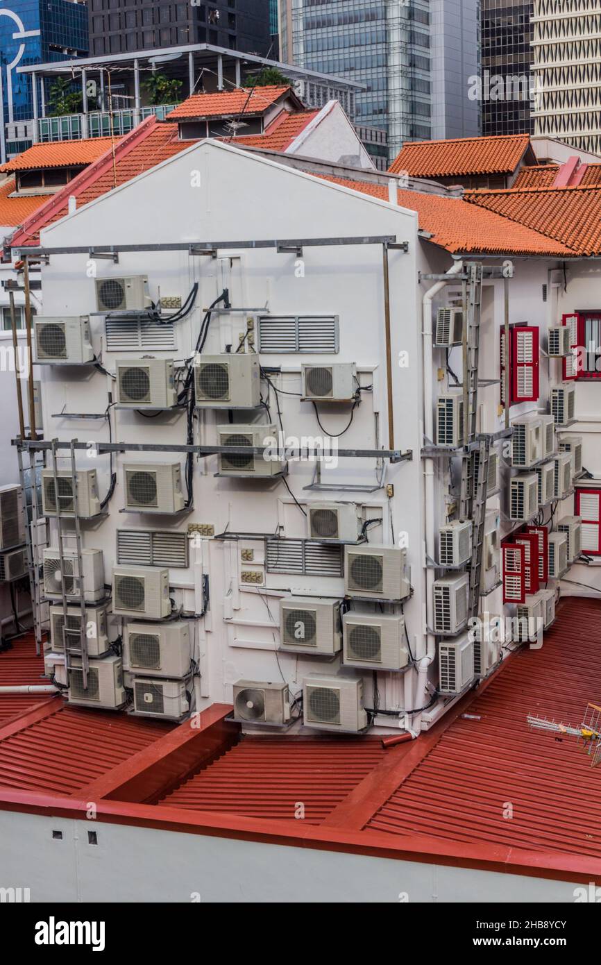 Building with many air conditioning units in Singapore Stock Photo - Alamy