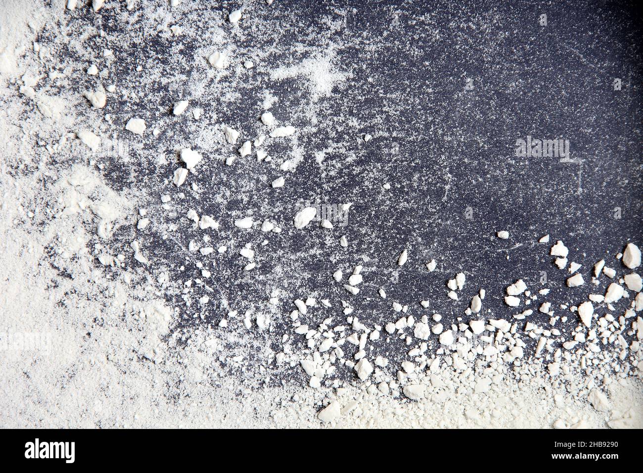 White dust. White powder. Scattering white particles. Abstract ...