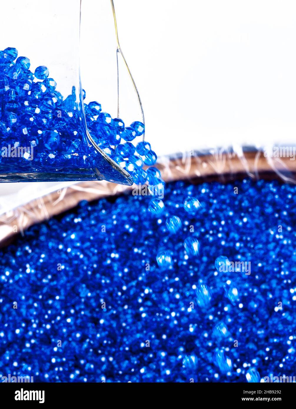 Pouring of Colorful plastic beads. Microplastics. Industrial plastic ...
